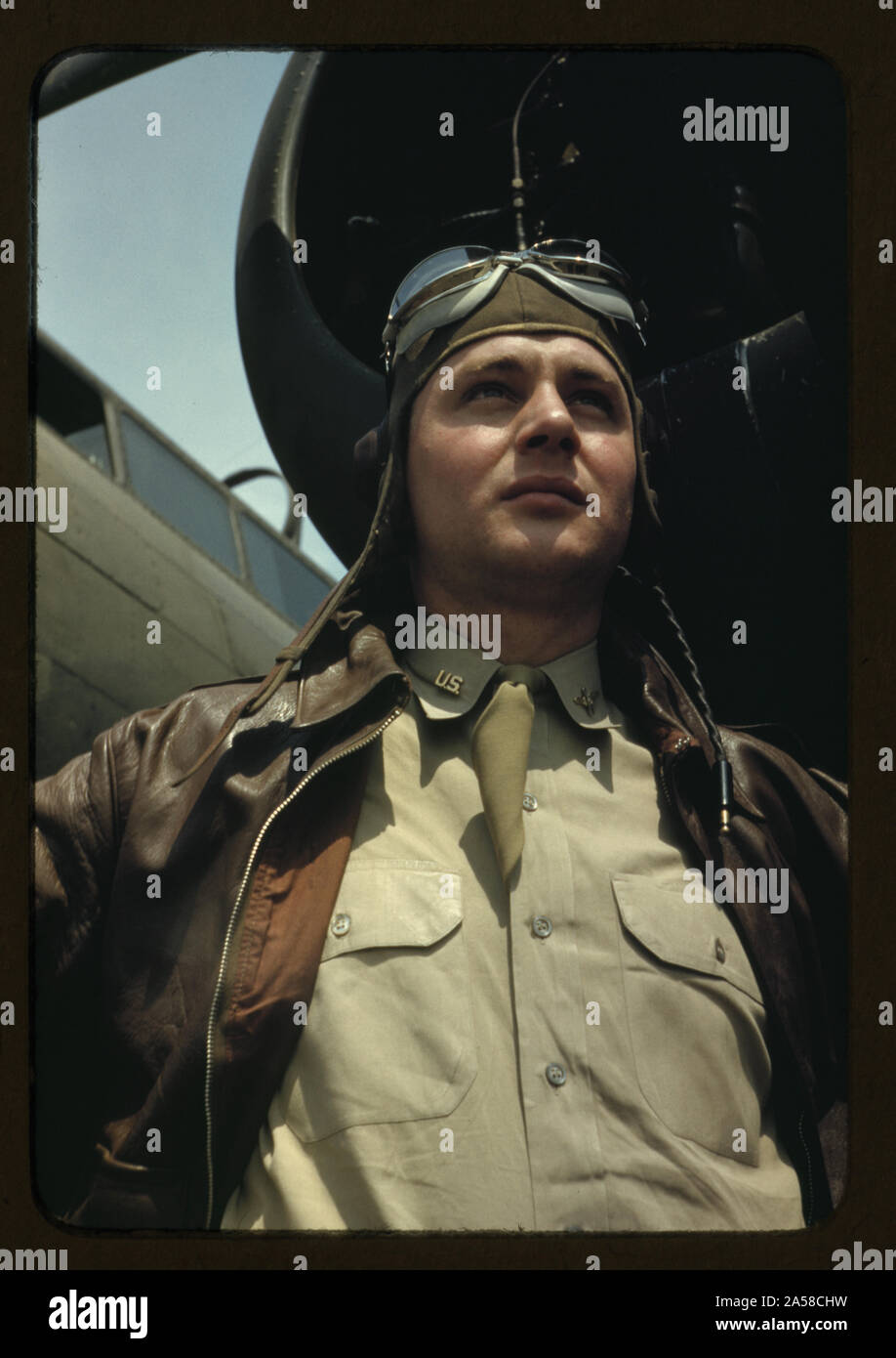U.S. Army Air Forces pilot in front of a YB-17 bombing airplane ...