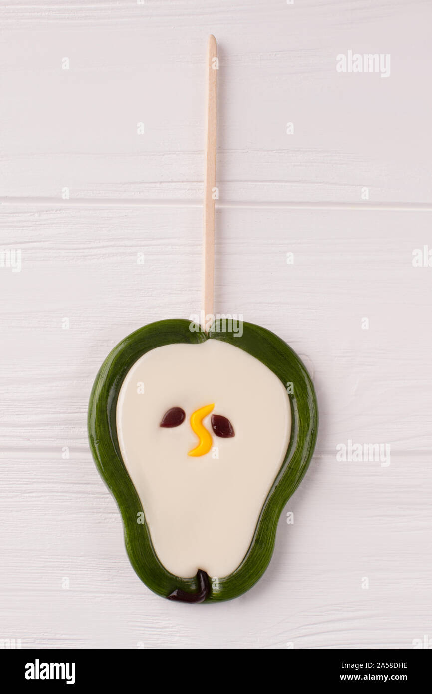 Pear lollipop on long stick Stock Photo - Alamy