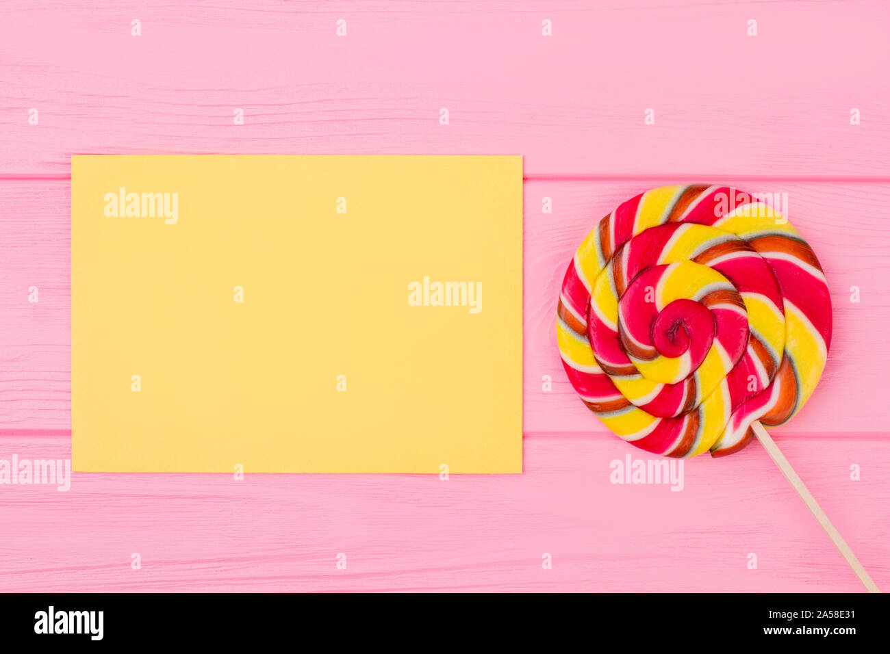 Spiral lollipop and blank paper sheet Stock Photo - Alamy