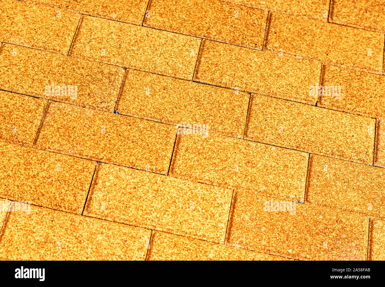Yellow ceramic paving stones as background texture close up Stock Photo ...