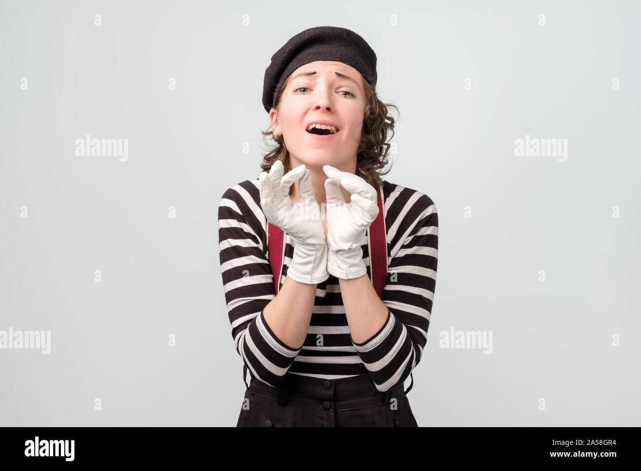 Beautiful french female mime smiling being excited Stock Photo - Alamy