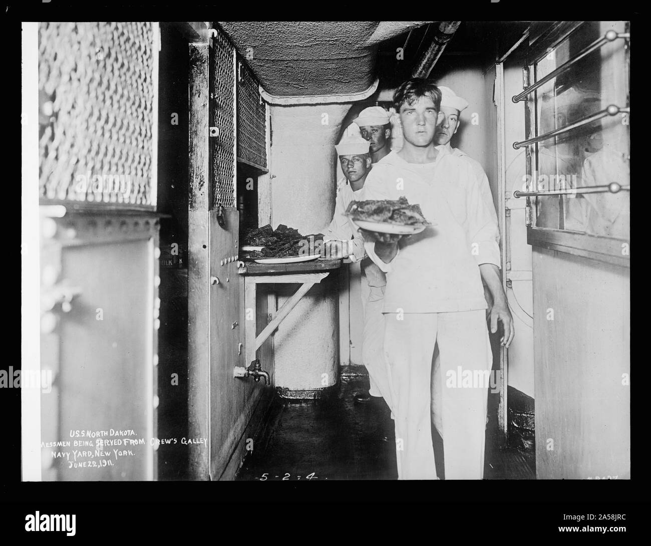 U.S.S. North Dakota. Messmen being served from Crew's Galley, Navy Yard ...