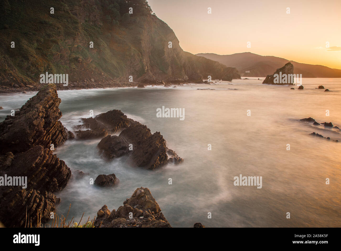 sunset at the basque coast in gaztelugatxe, northern spain Stock Photo ...