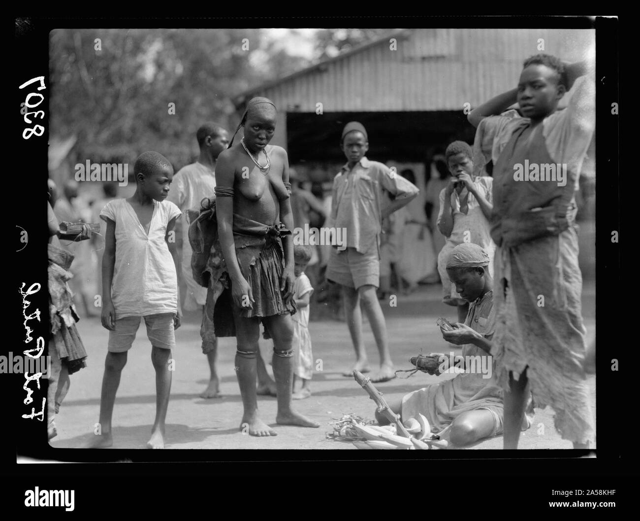 Uganda. From Hoima to Fort Portal. Types in the native market. Woman ...