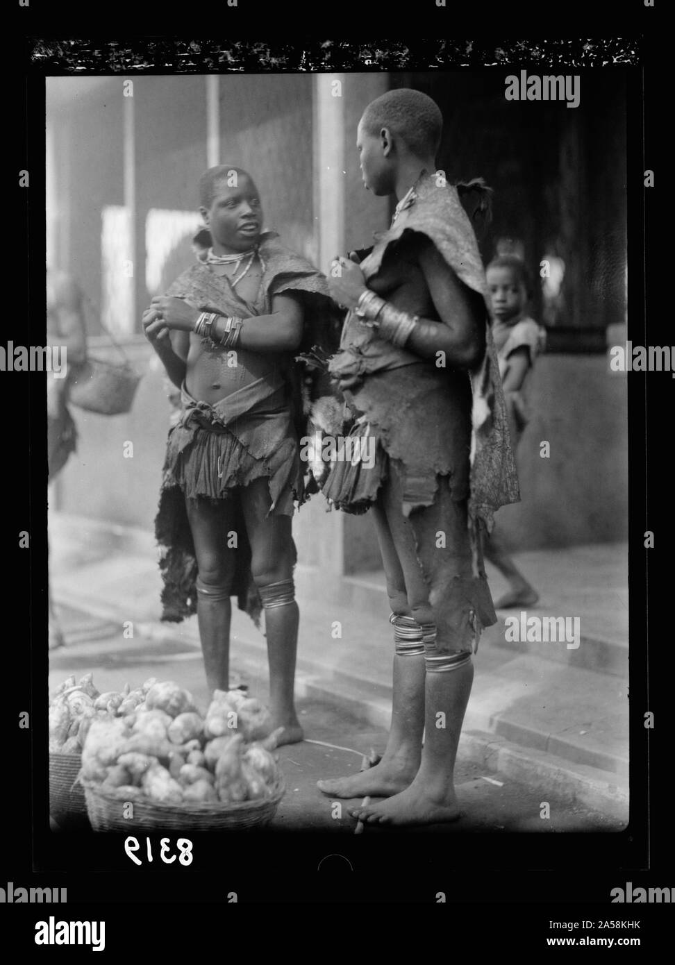 Uganda. From Hoima to Fort Portal. Types in the native market. Women ...