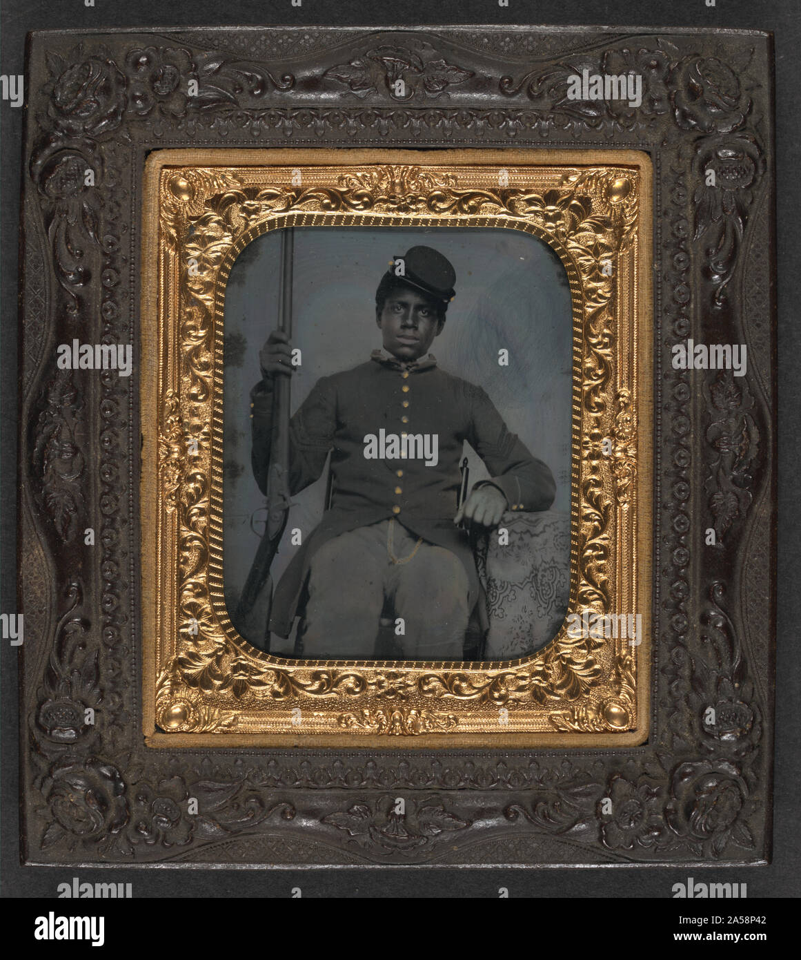 Unidentified African American soldier in Union sergeant uniform holding ...