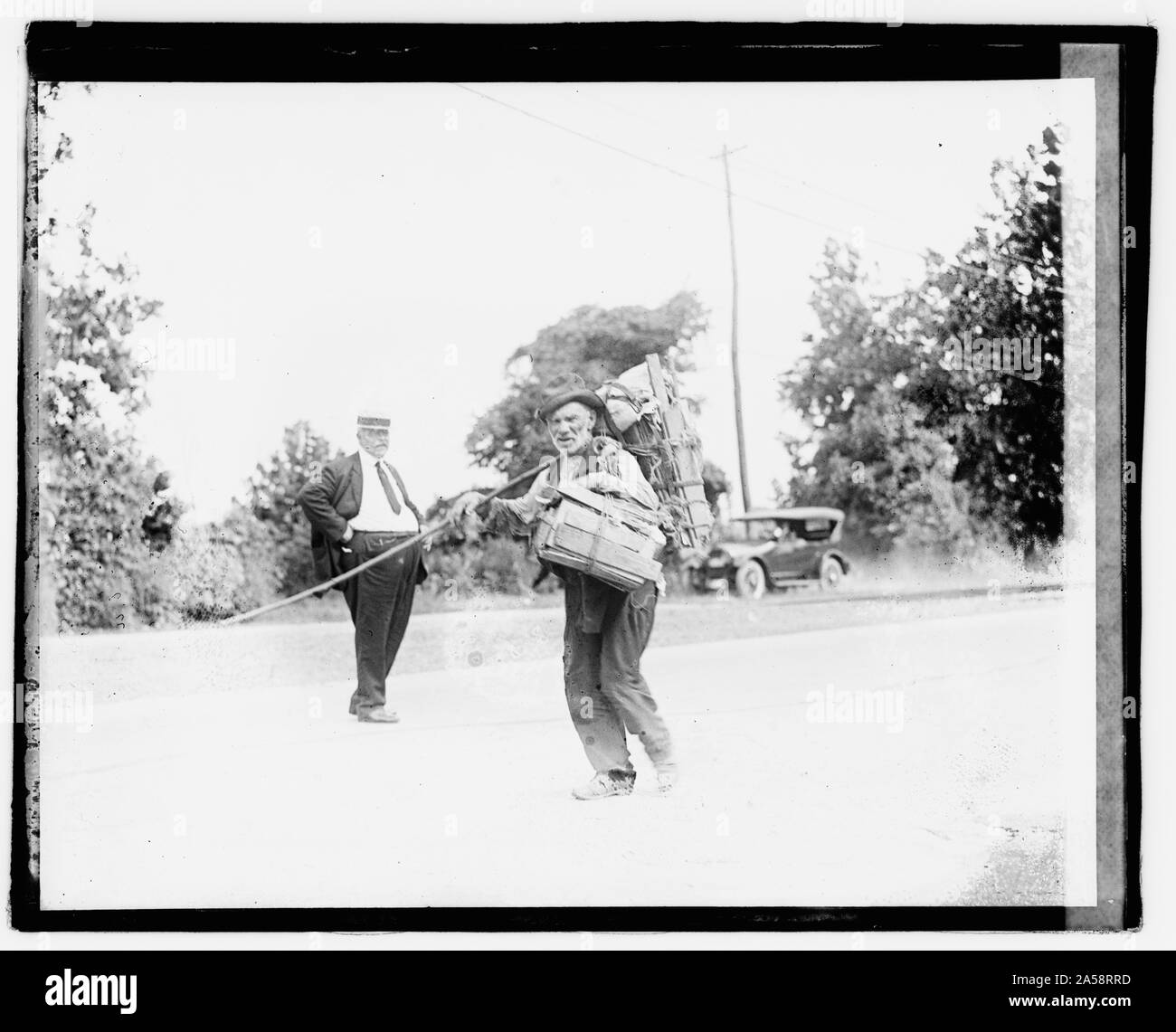 Man carrying bundles hi-res stock photography and images - Alamy