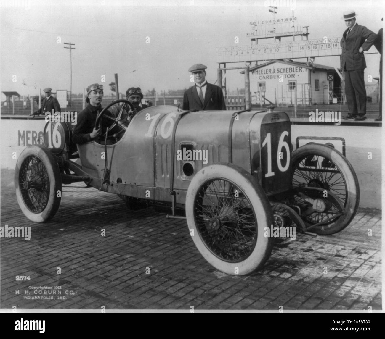 Unidentified men seated in racing cars Stock Photo - Alamy