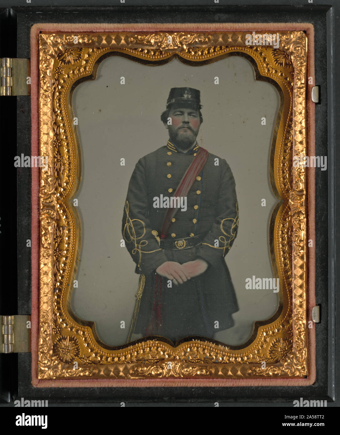 Unidentified soldier in Confederate captain's uniform, red sash, and ...