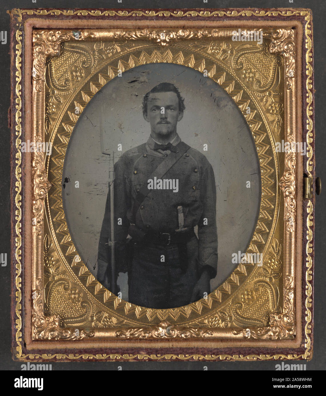 Unidentified soldier in Confederate uniform with musket and Bowie knife ...