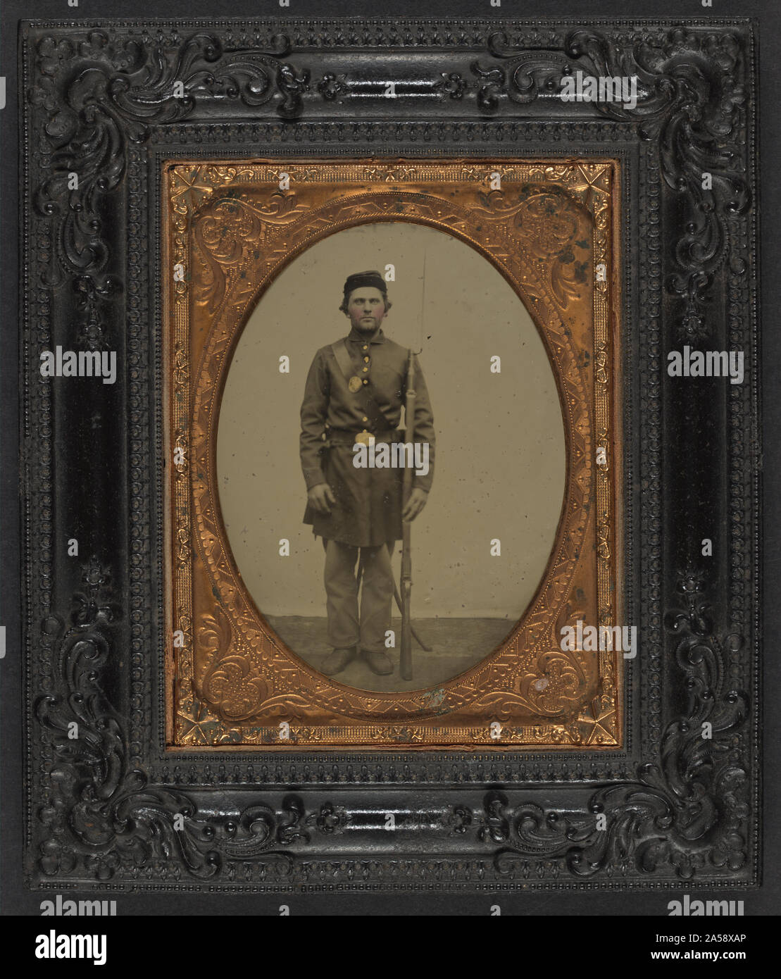 Unidentified soldier in Union frock coat and forage cap with bayonet ...