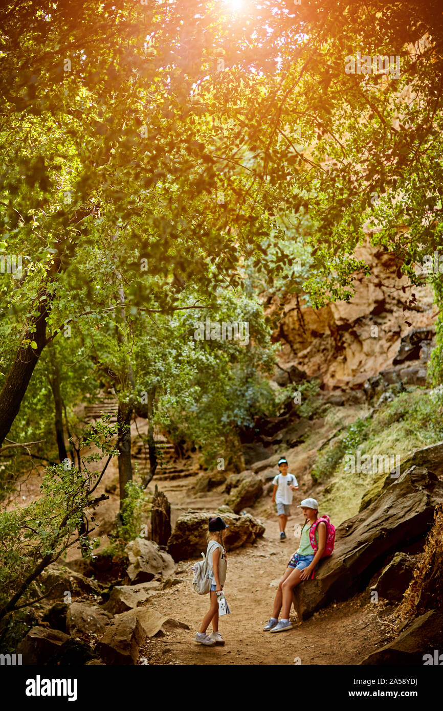 Three children walk hi-res stock photography and images - Alamy