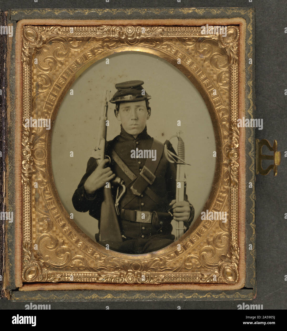 Unidentified soldier in Union uniform holding a U.S. Model 1855 pistol ...