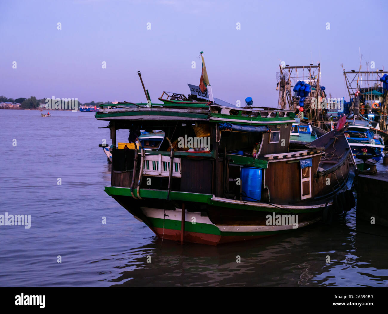 YANGON, MYANMAR - CIRCA DECEMBER 2017: Boat in the Yangon fish market ...