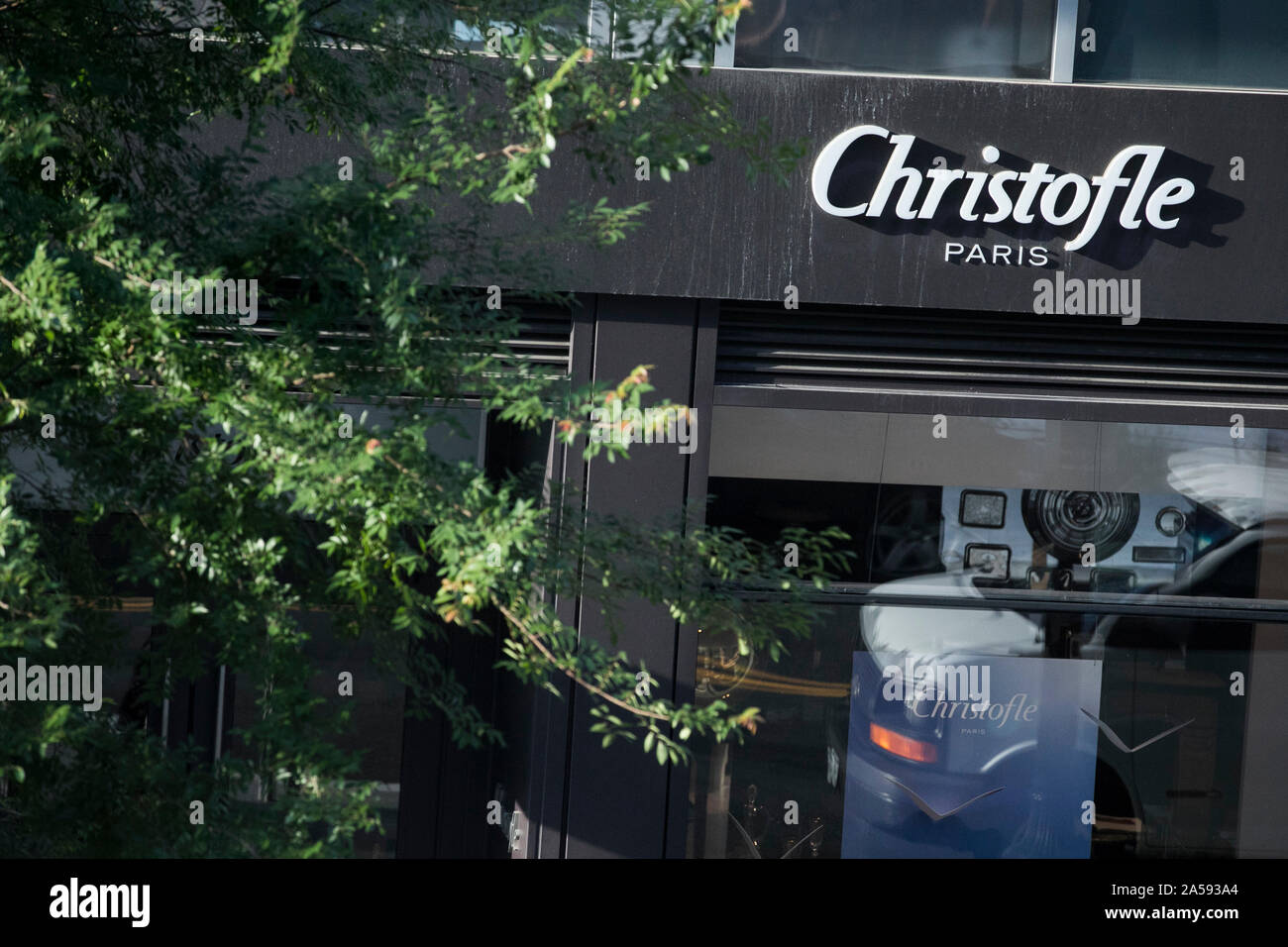 A logo sign outside of a Christofle retail store location in downtown ...