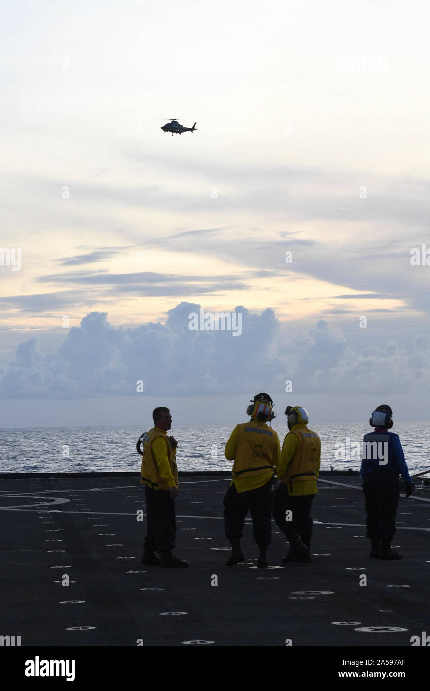 SULU SEA (Oct. 17, 2019) U.S. Navy Flight deck crew observe a ...