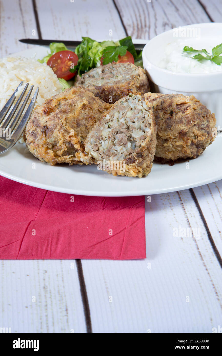 Traditional Turkish dish of Kadinbudu kofte, Cacik and Pilaf rice with ...