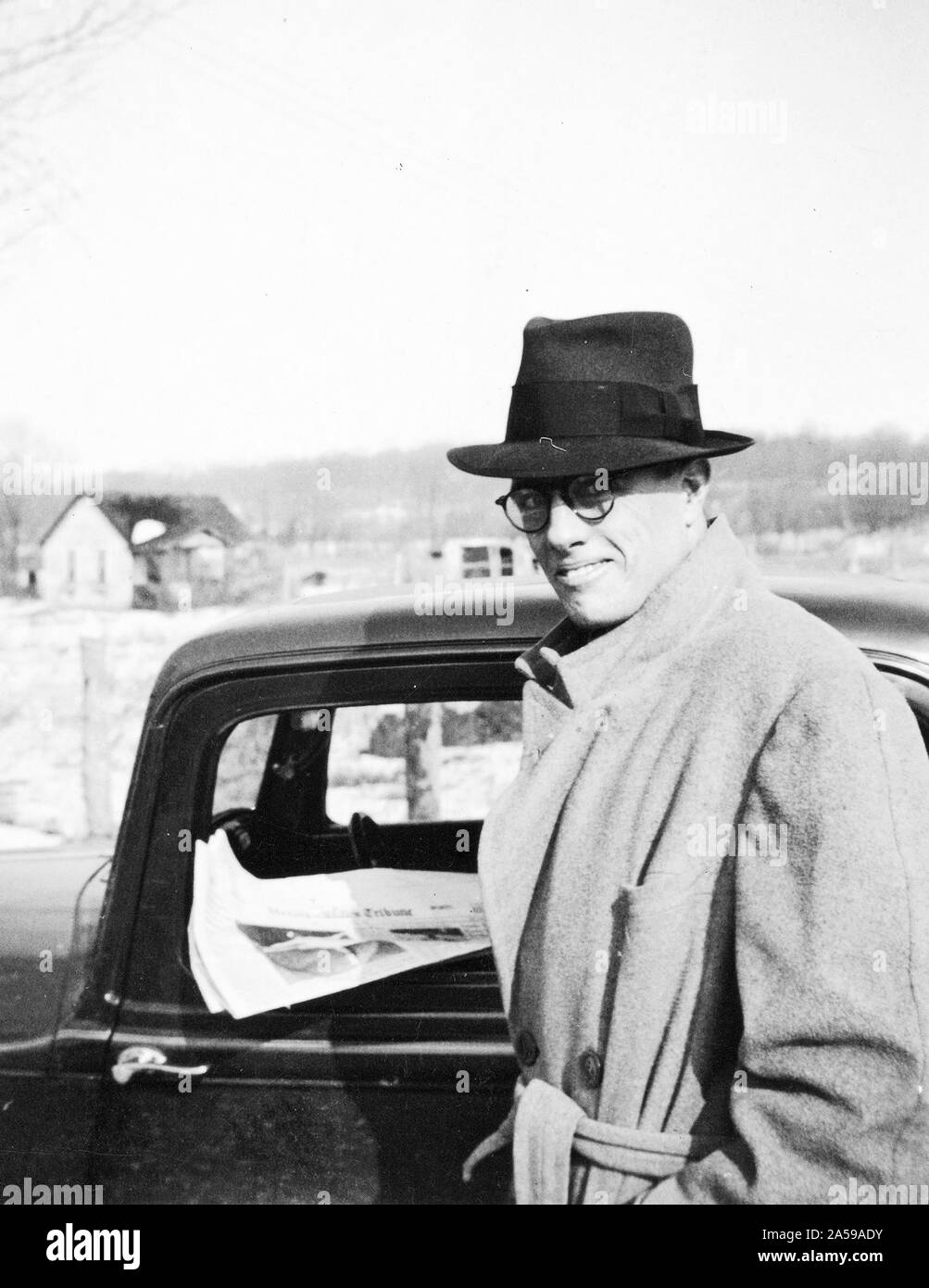 John Avery Lomax, Jr. standing next to car, looking left ca. 1930-1950 ...