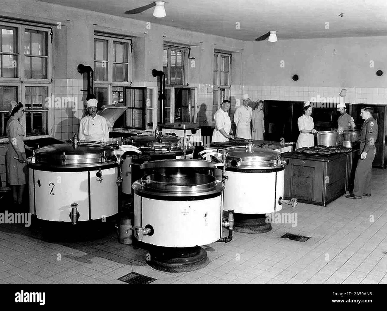 A few of the 12 cooks who are employed at the 97th General Hospital ...
