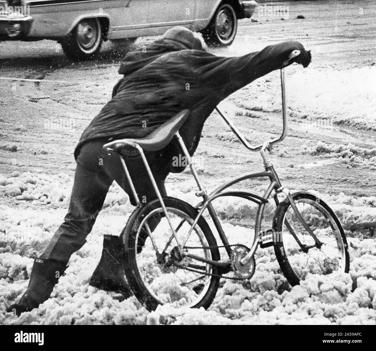 Boy pushing bike Black and White Stock Photos & Images - Alamy