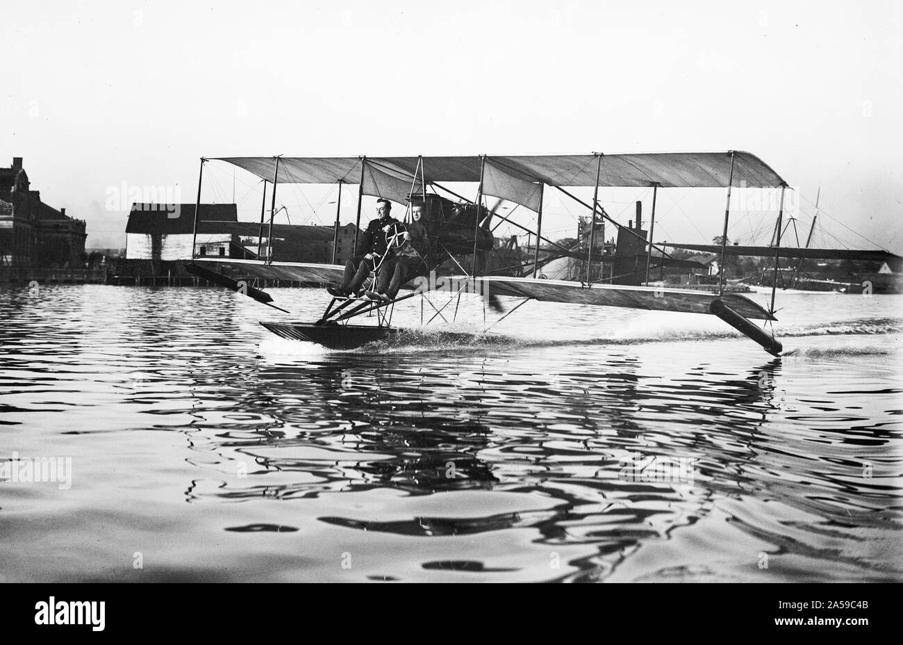 U.S. Navy Lieutenant Theodore Ellyson testing a seaplane on the Potomoc ...