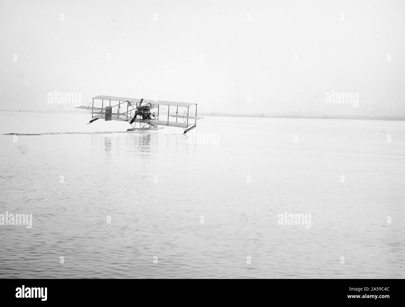 U.S. Navy Lieutenant Theodore Ellyson testing a seaplane on the Potomoc ...