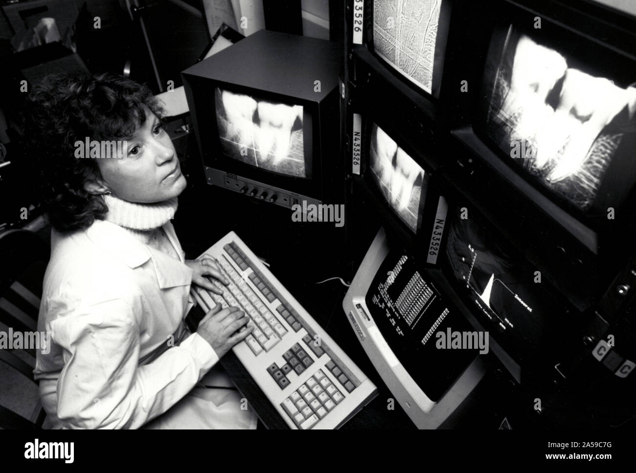 Researcher at the National Institute of Dental Research (NIDR) uses ...