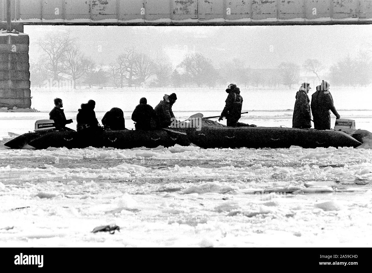1982 - Navy divers operate from rubber rafts to recover victims and ...
