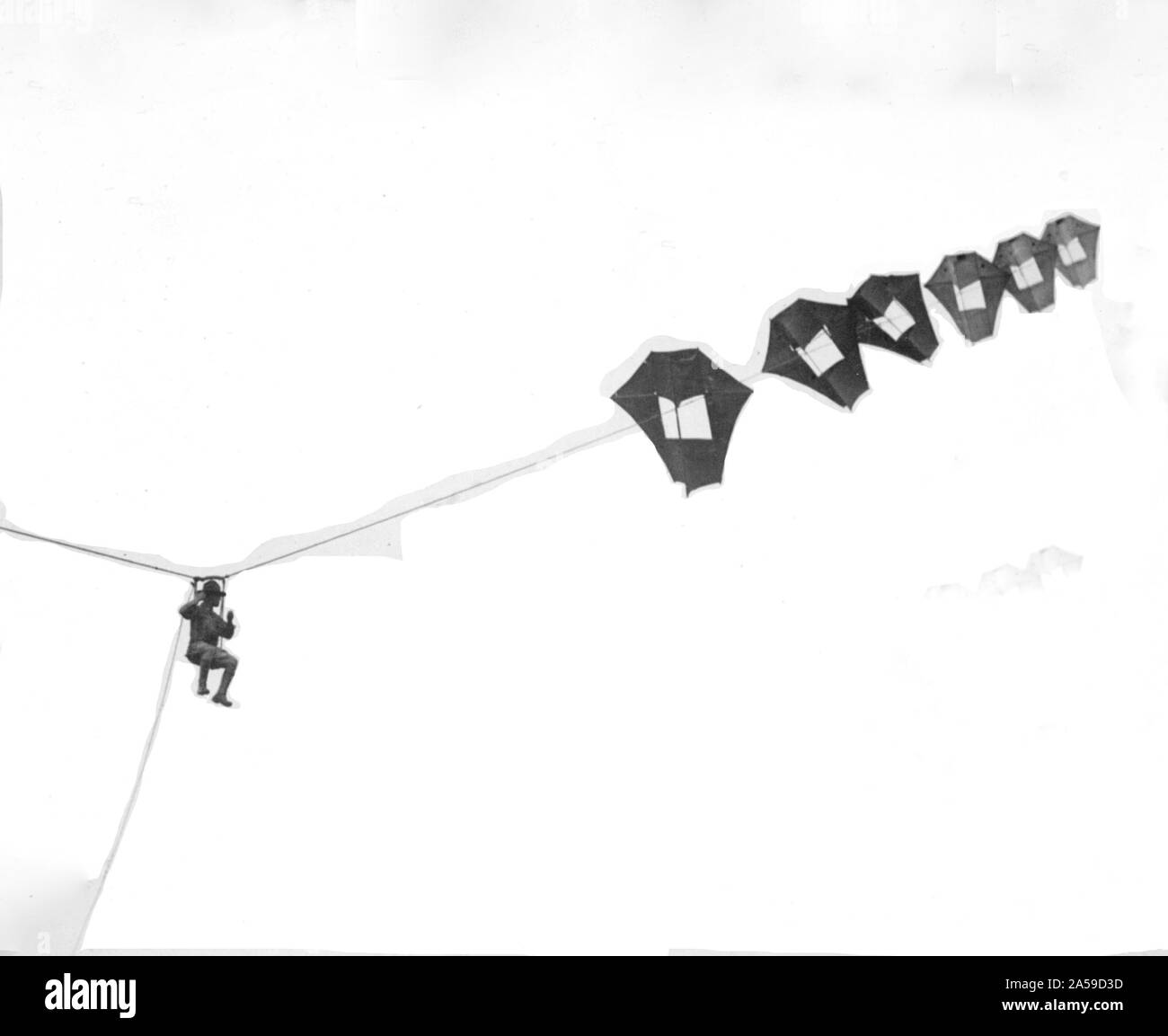 Lieutenant Kirk Booth of the U.S. Signal Corps being lifted skyward by ...