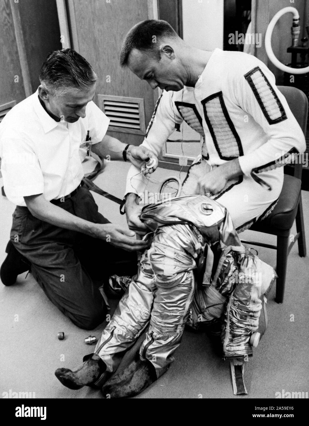 (5 May 1961) --- Astronaut Alan B. Shepard Jr. is being helped into the ...