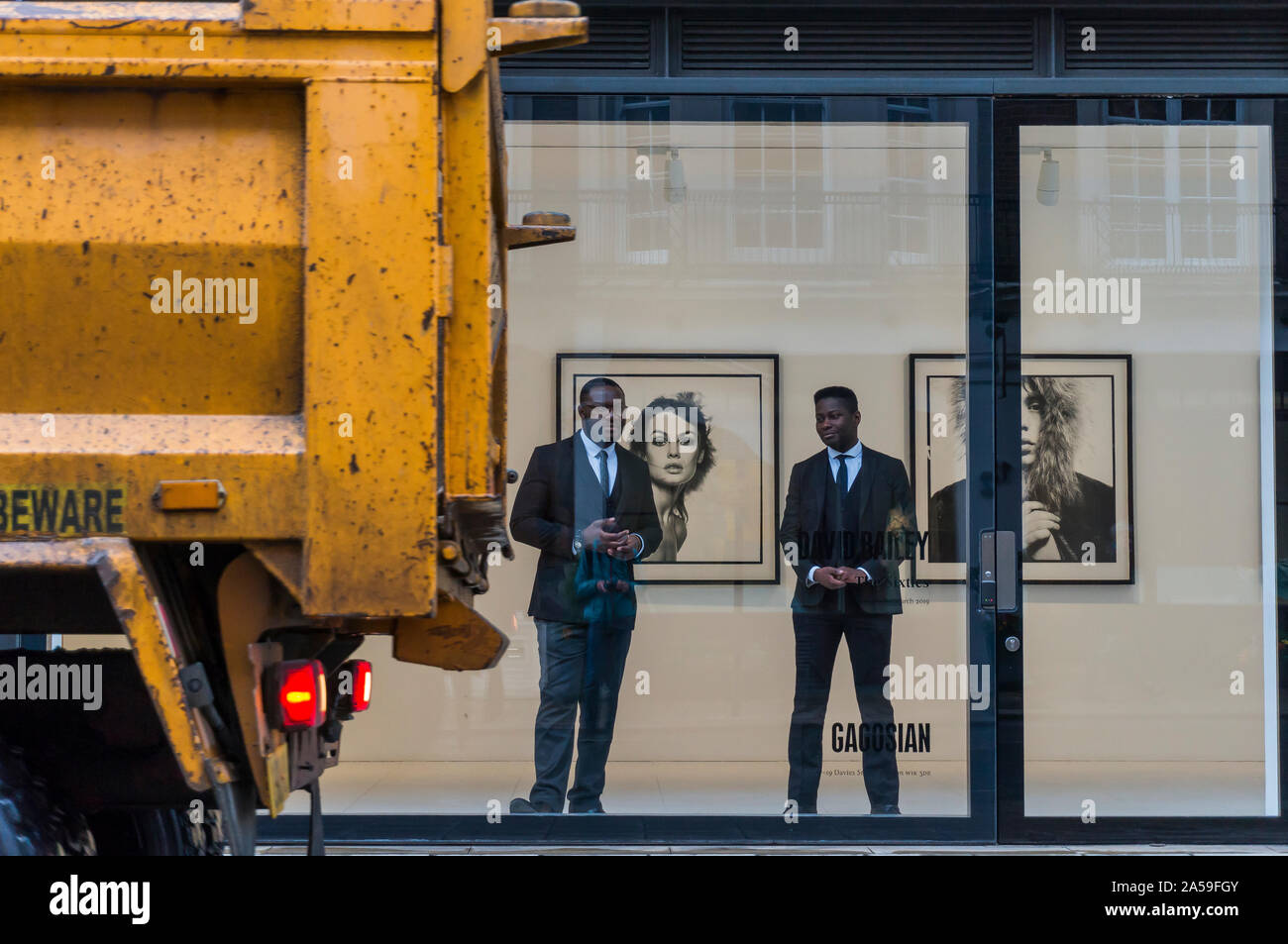 London Street Photography in Mayfair, Greater London. Security guard ...