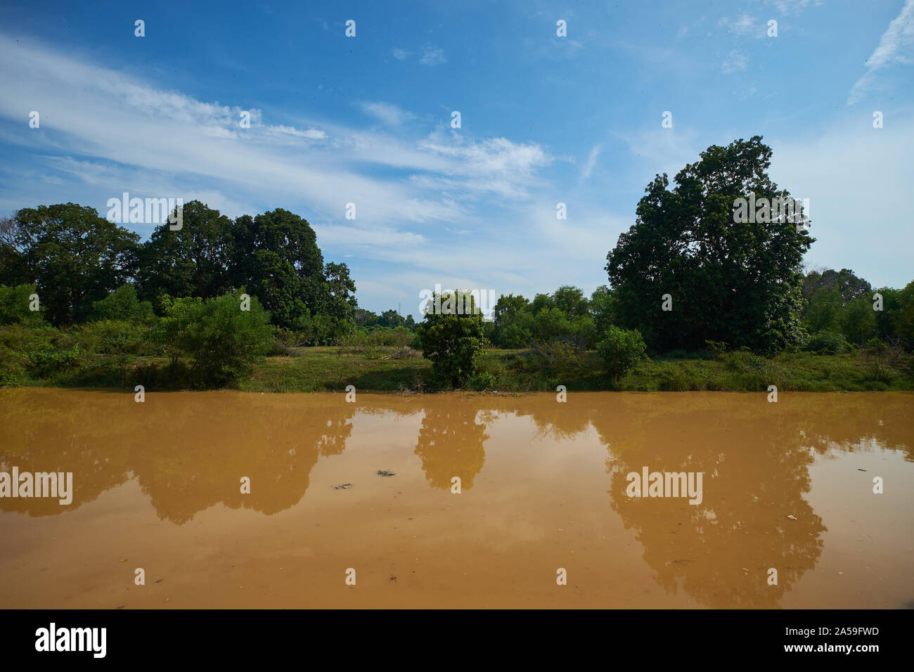 Looking across the muddy Pahang river in the town of Pekan. Many rivers ...