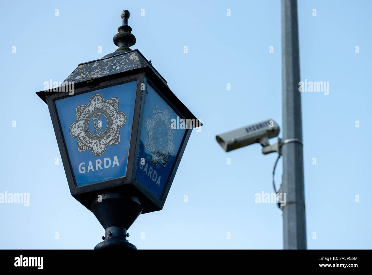 Garda Police lamp sign and CCTV security camera. Security concept ...