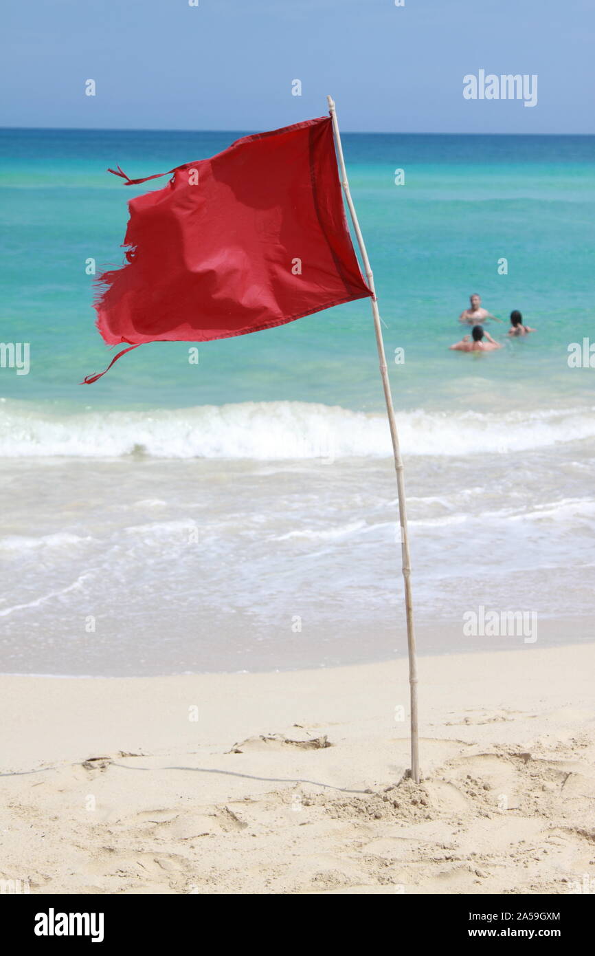 Red flag beach hi-res stock photography and images - Alamy