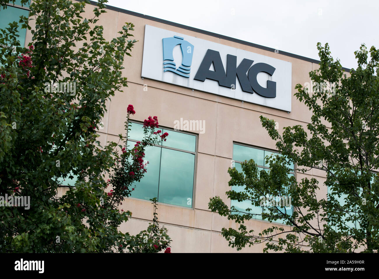 A logo sign outside of a facility occupied by the AKG Group in Mebane, North Carolina on ...