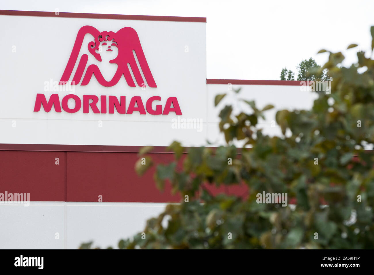 A logo sign outside of a facility occupied by Morinaga & Company in ...