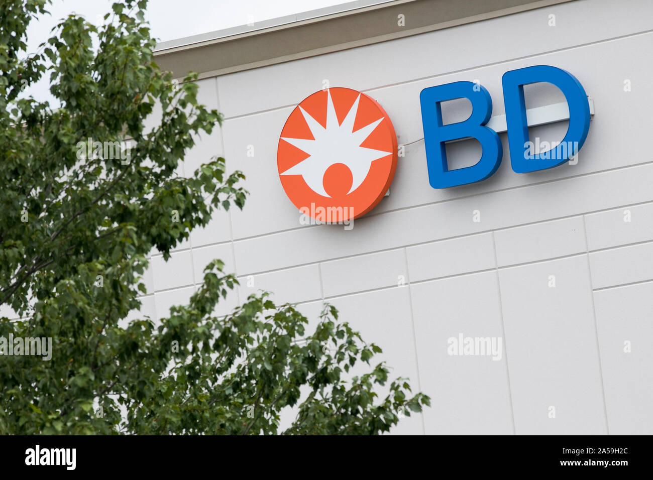A logo sign outside of a facility occupied by Becton, Dickinson and ...