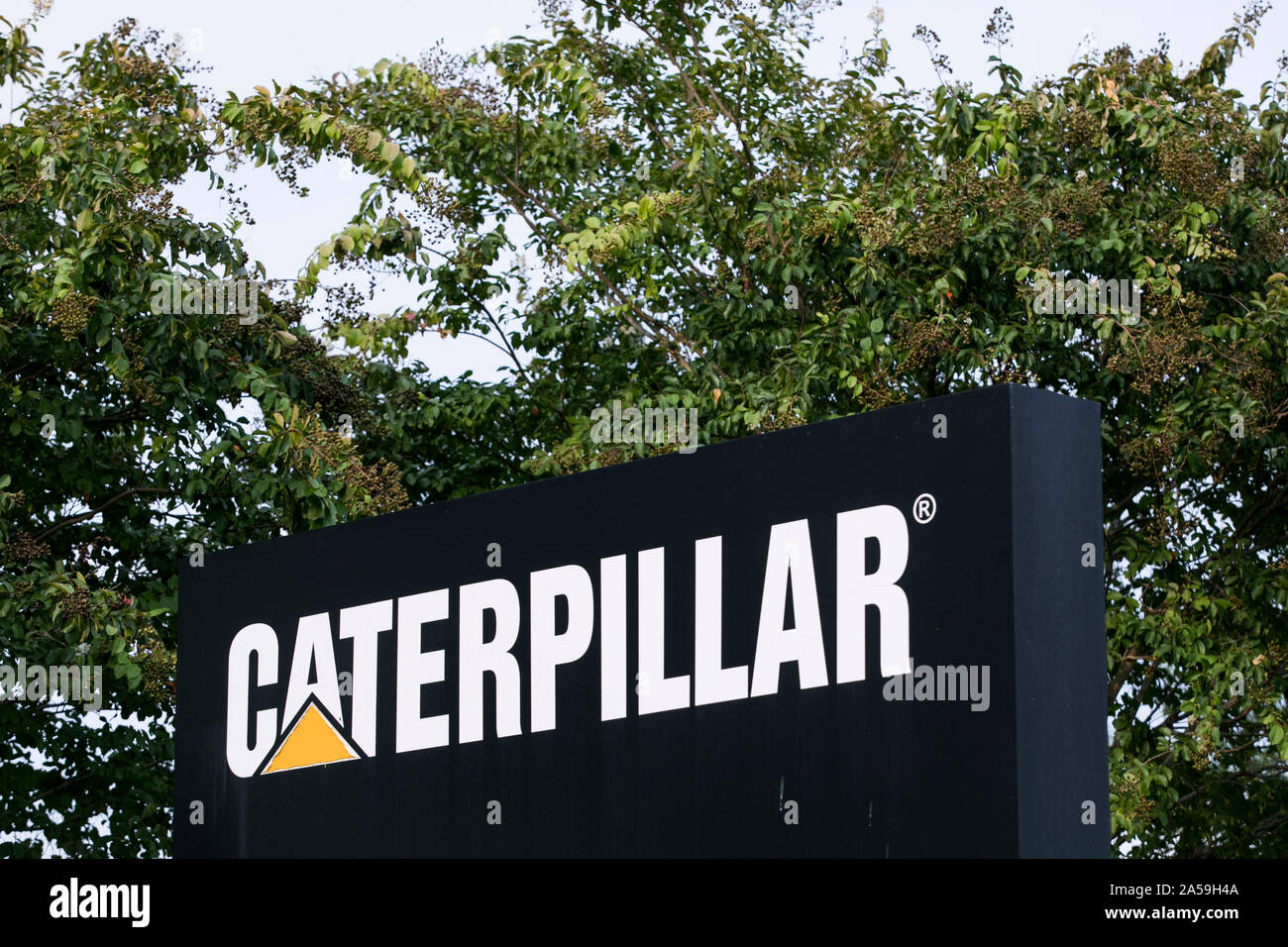 A logo sign outside of a facility occupied by Caterpillar, Inc., in ...