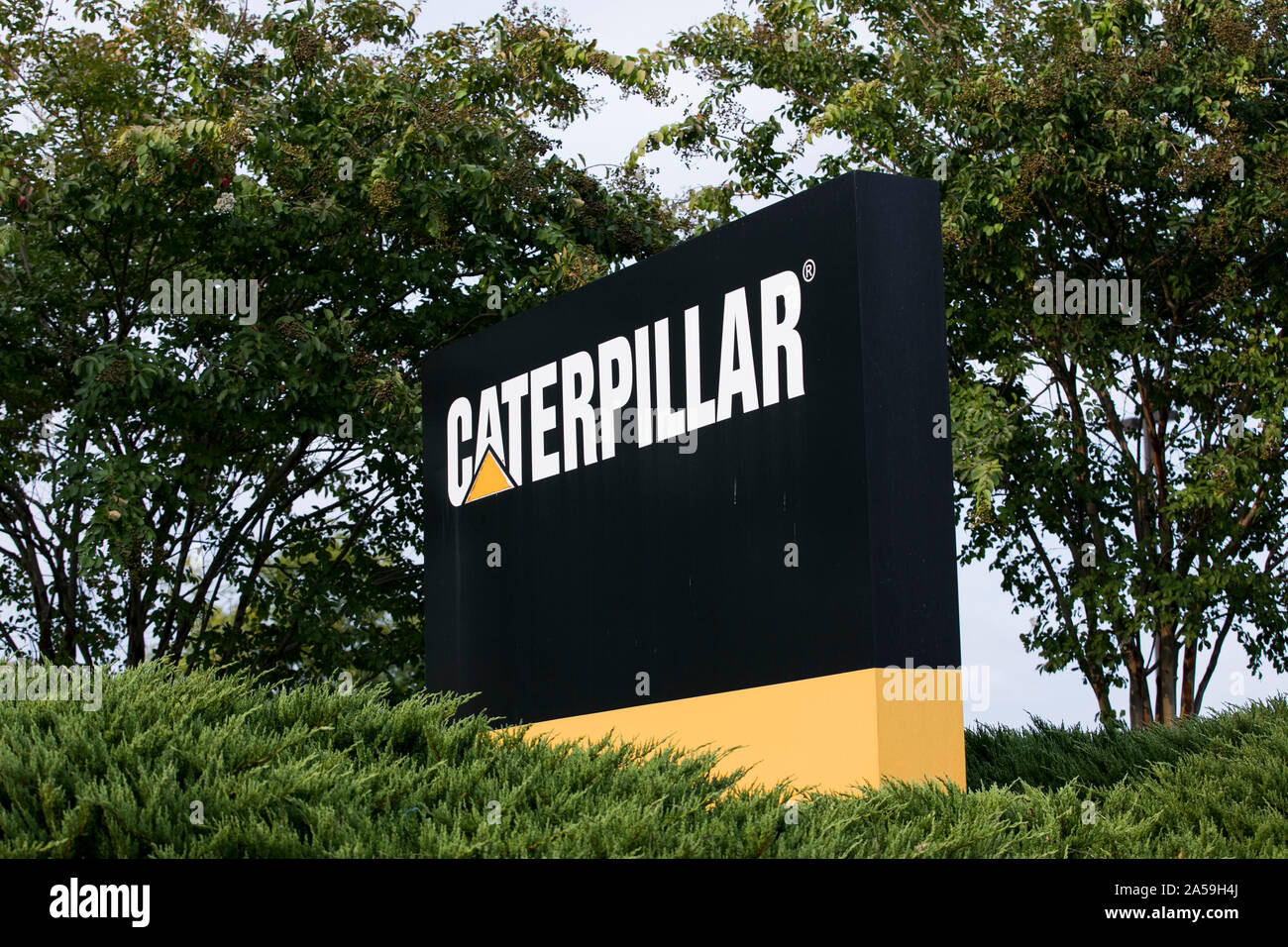 A logo sign outside of a facility occupied by Caterpillar, Inc., in ...