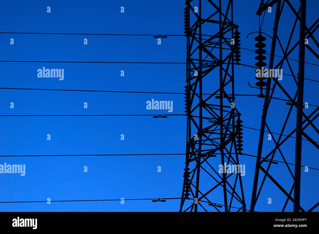 Electric pylon structure and dusk sky Stock Photo - Alamy