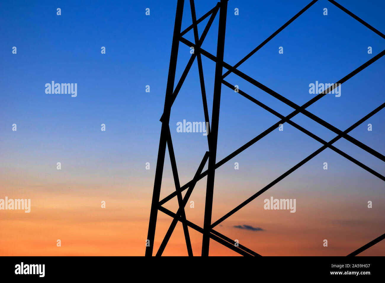 Electric pylon structure and dusk sky Stock Photo - Alamy
