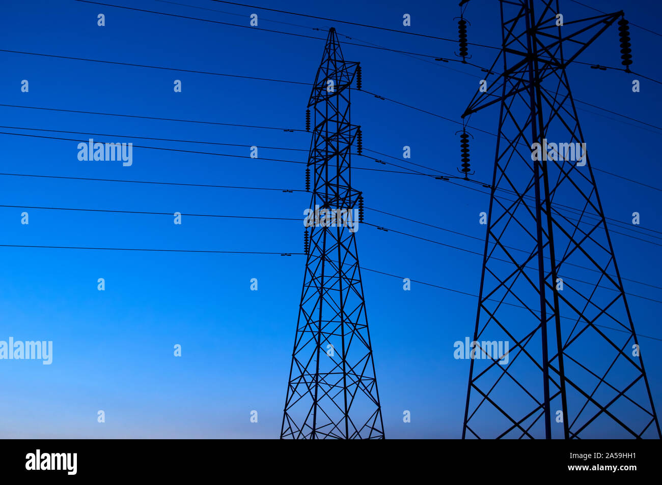 Electric pylon structure and dusk sky Stock Photo - Alamy