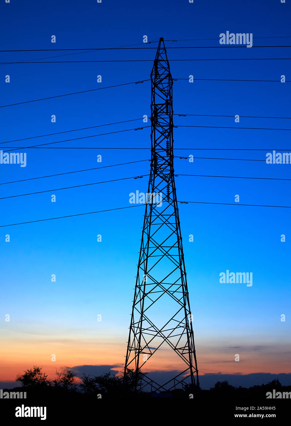 Electric pylon structure and dusk sky Stock Photo - Alamy