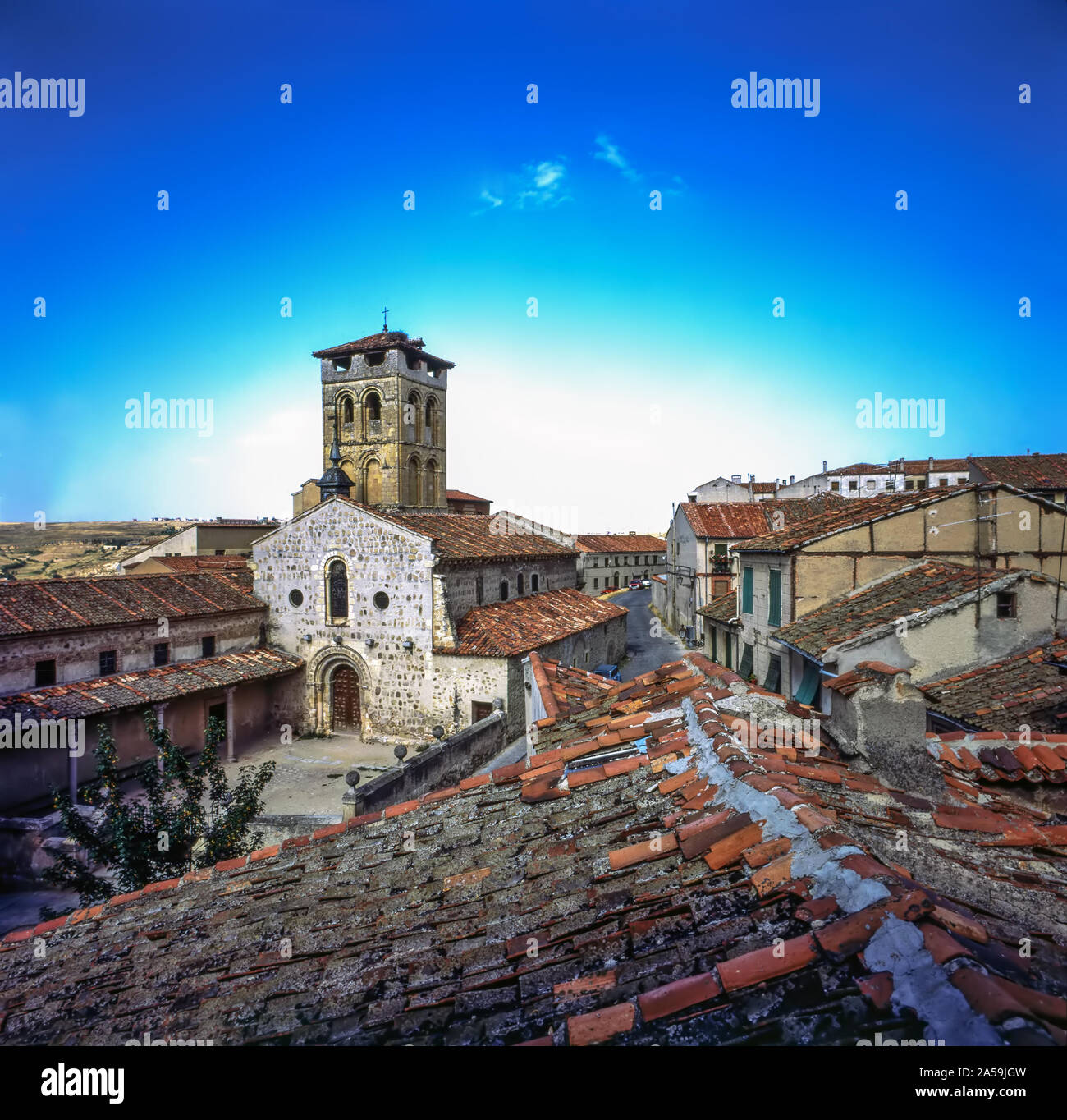 View of church Iglesia de Santos Justo y Pastor and street in Segovia ...