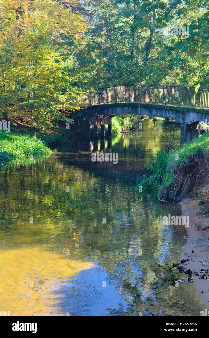 Old concrete park bridge over brook Stock Photo - Alamy