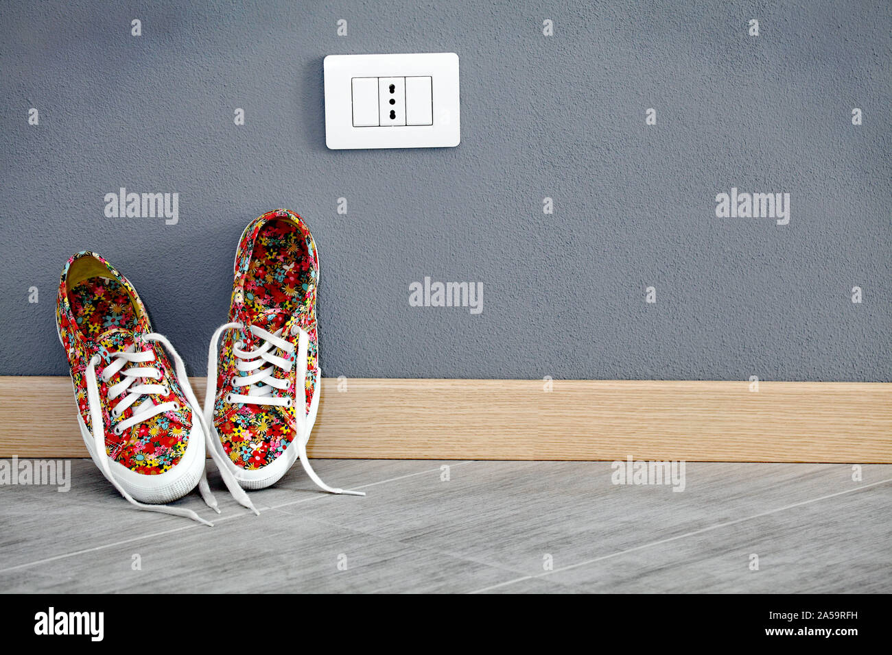 shoes resting on the wall Stock Photo - Alamy