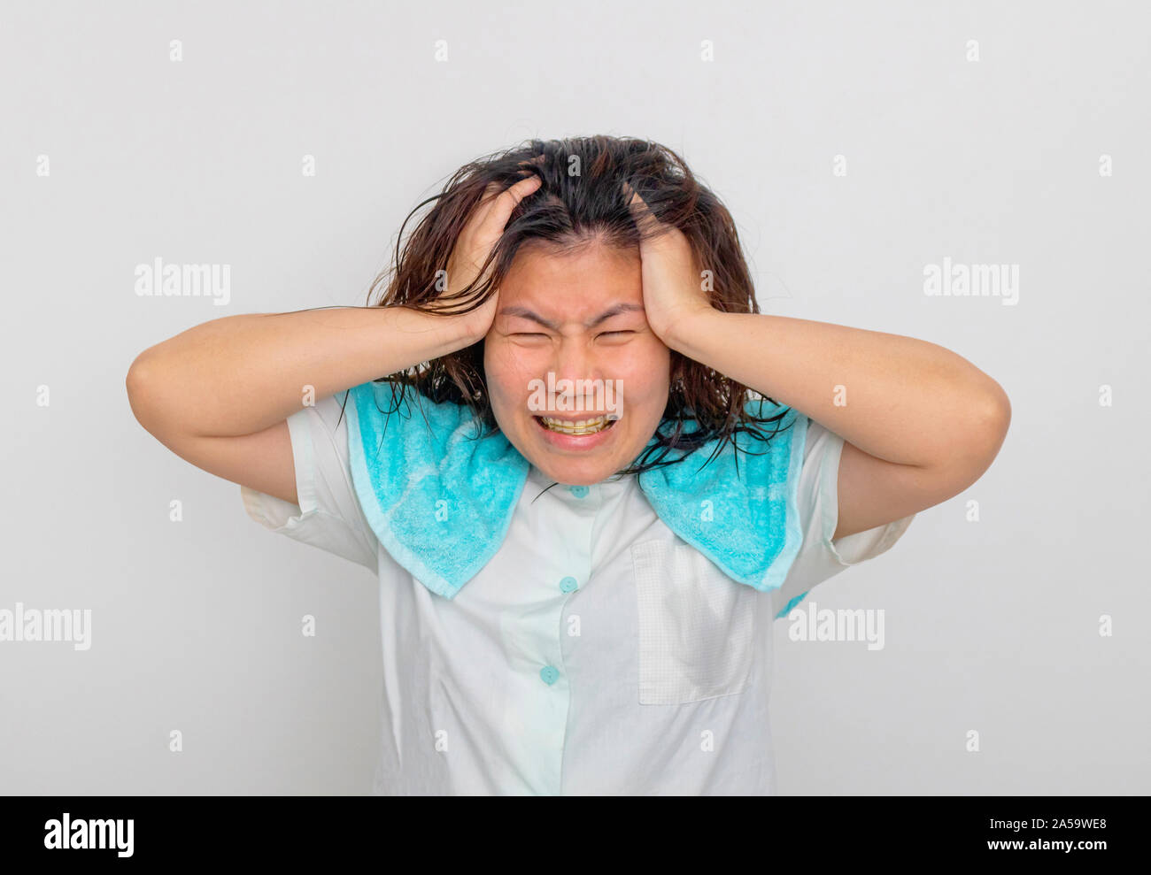 The Asian girl are having headache and screaming with painful in her ...