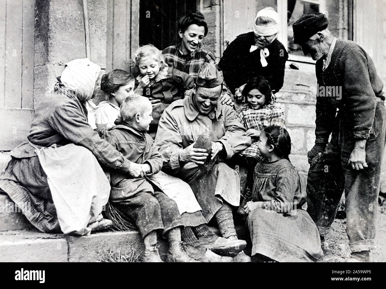 Army chaplain speaking with french family hi-res stock photography and ...