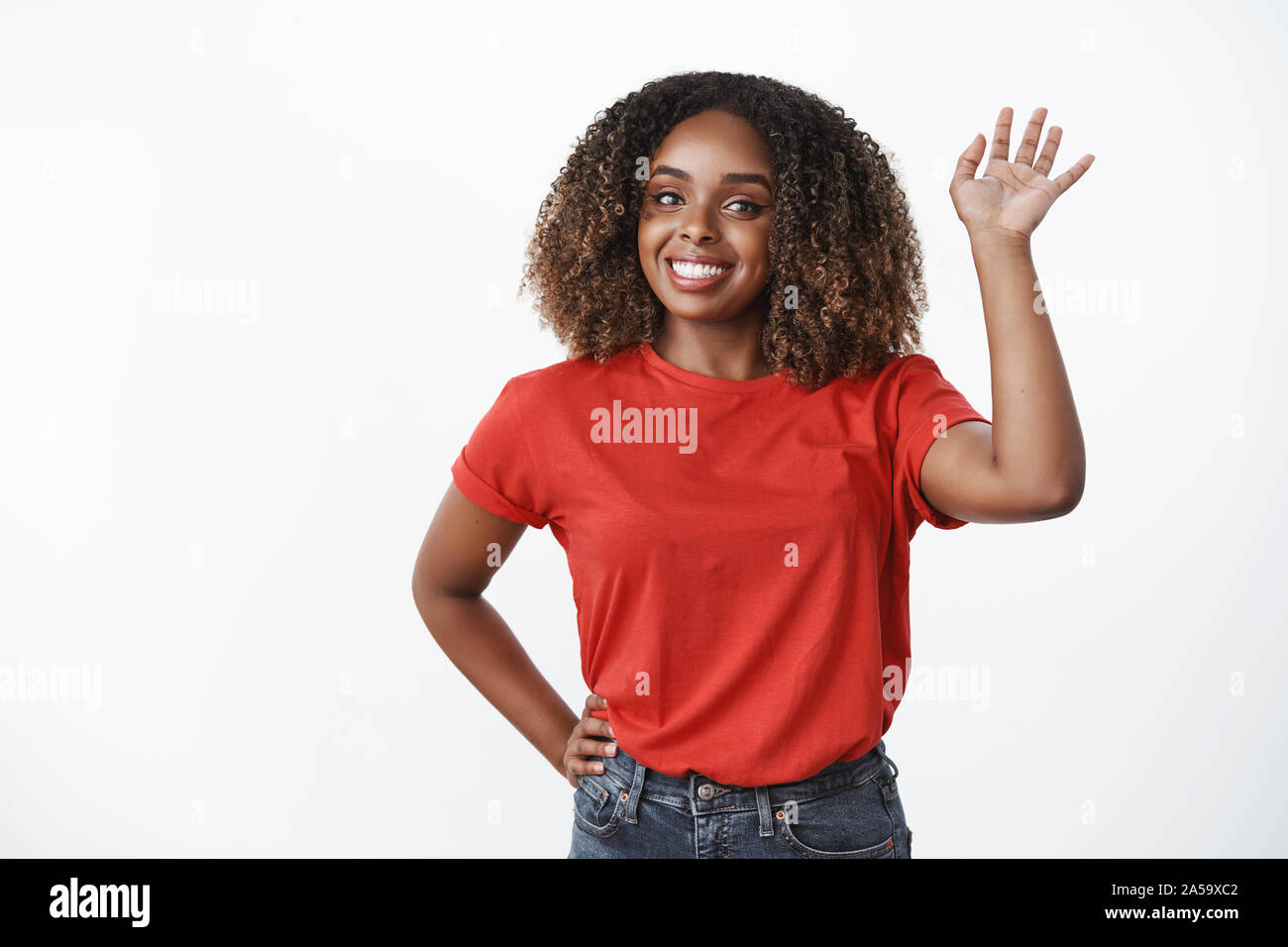 Cheerful, friendly african american woman with afro hairstyle, raising ...