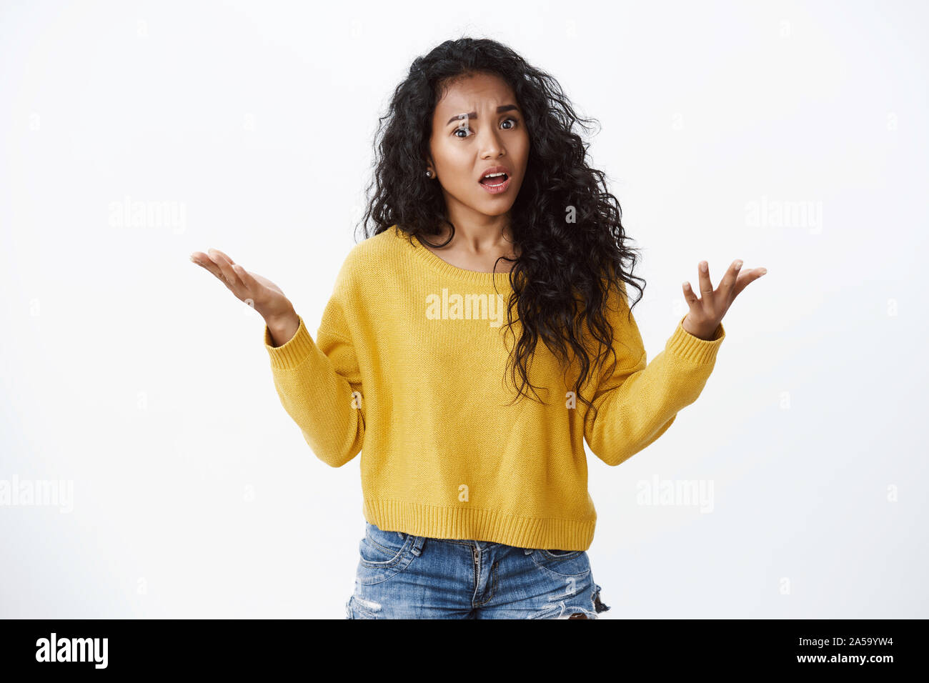 Pretty african-american woman pissed-off looking outraged, raise hands ...